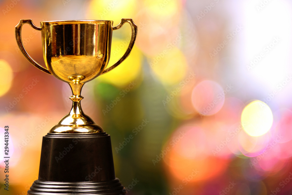 Gold trophy cup on full color background with bokeh Stock Photo | Adobe ...