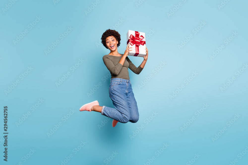 Full length body size photo of excited crazy cheerful nice positive ecstatic woman wearing jeans ...