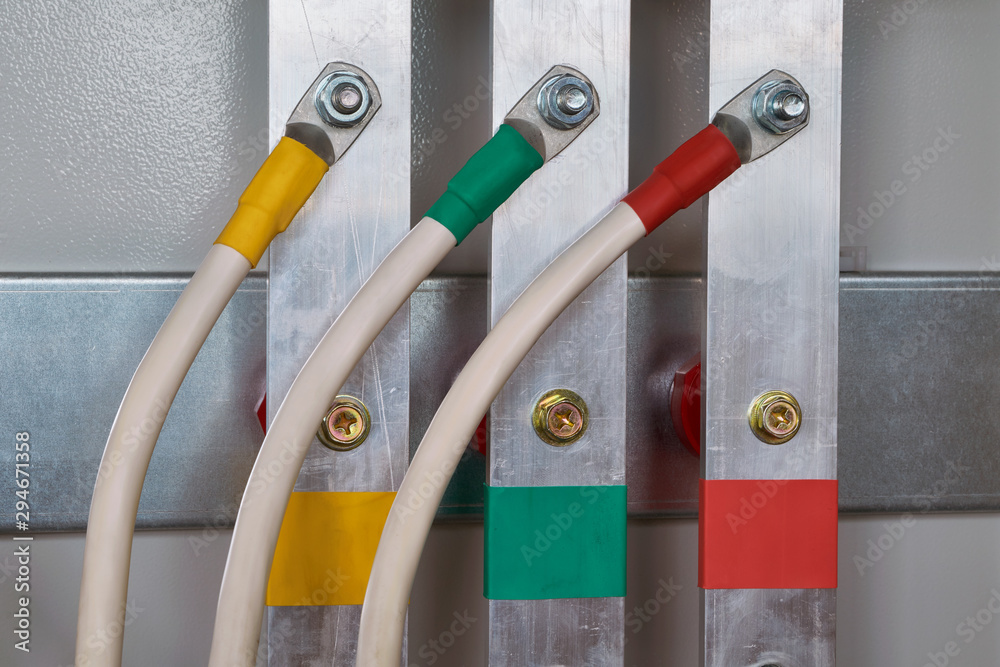 Three electric cable is connected to the vertical aluminum busbars in ...