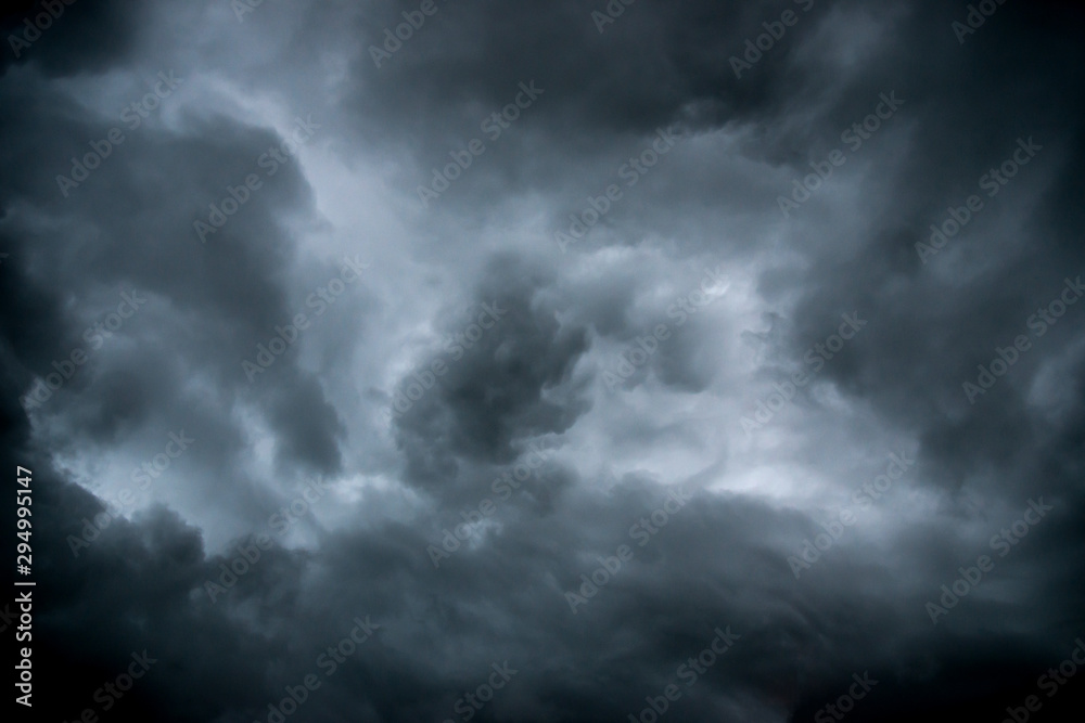 Dark sky and dramatic black cloud before rain.A tropical cyclone is a ...