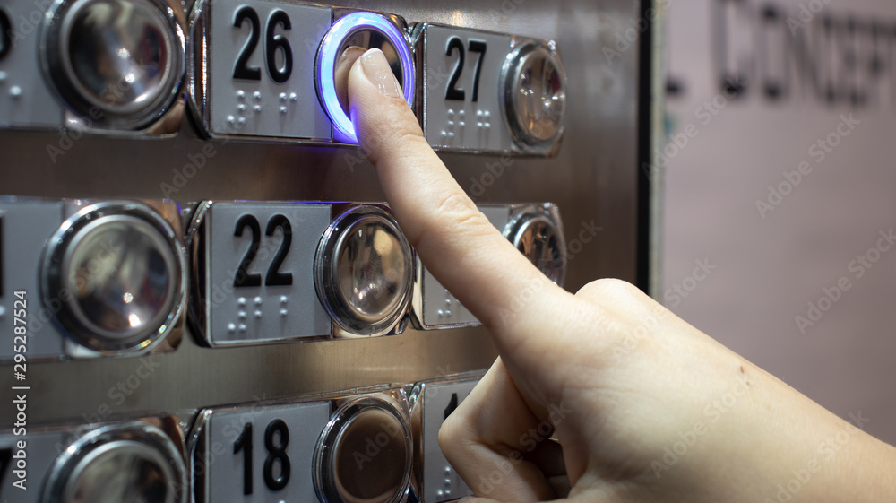 Finger pushing button in elevator Stock Photo | Adobe Stock