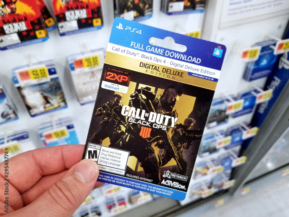 Gift card of a video game in a hand Stock Photo | Adobe Stock