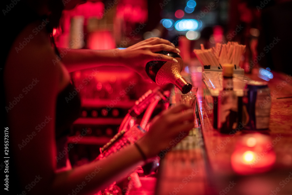 Bartender pouring shots Stock Photo | Adobe Stock