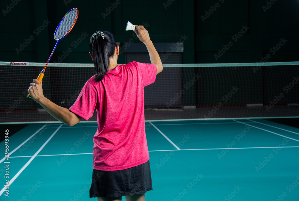 Back view Asian woman Badminton player in red sport shirt holding ...