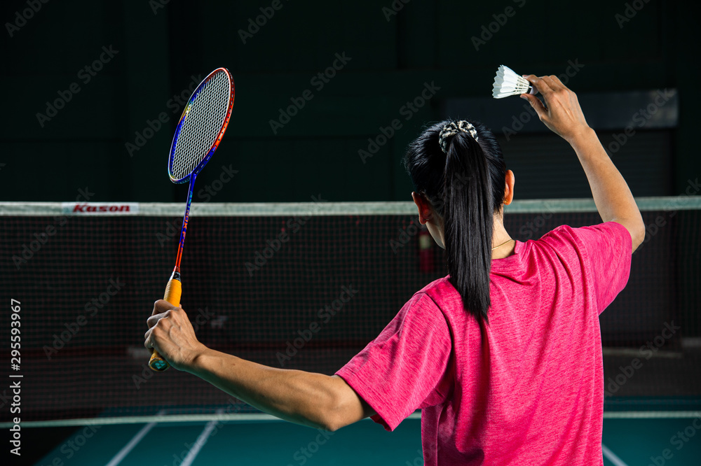 Back view Asian woman Badminton player in red sport shirt holding ...