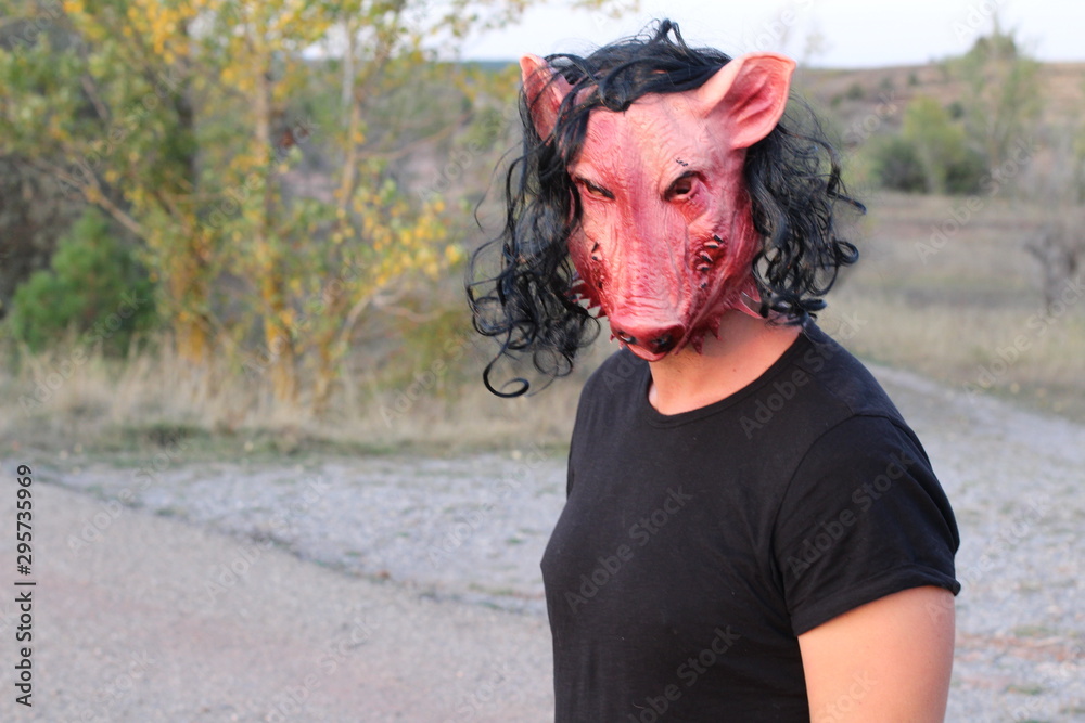 Scary human pig with long hair Stock Photo | Adobe Stock