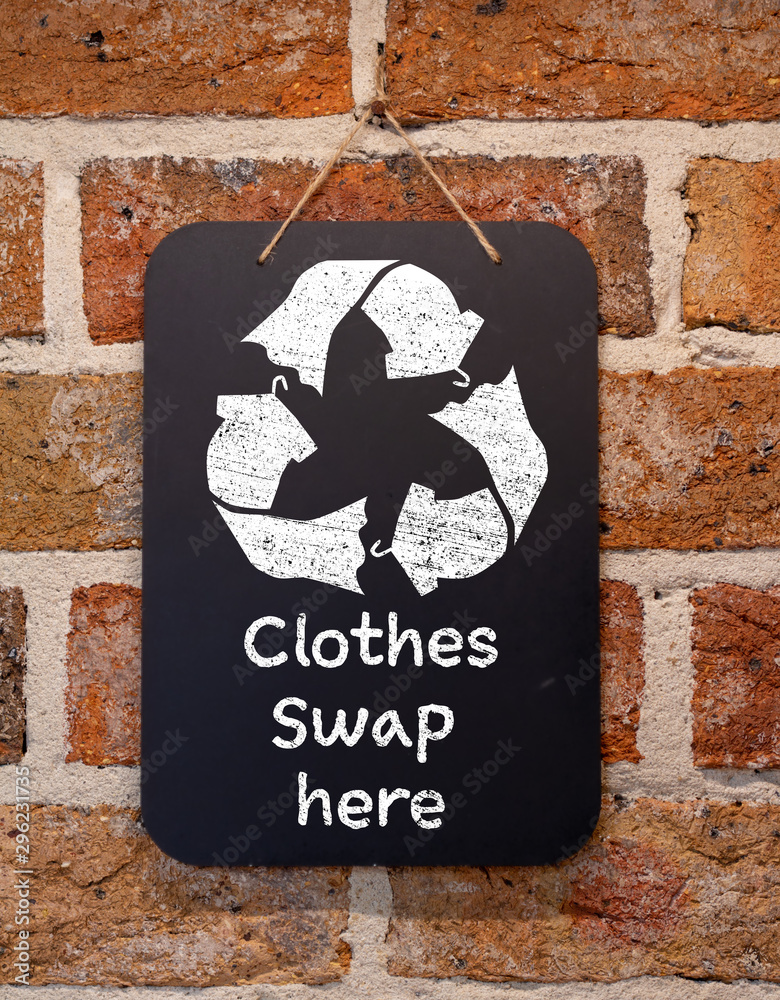 Clothes Swap here text and symbol on chalk board, sustainable fashion ...