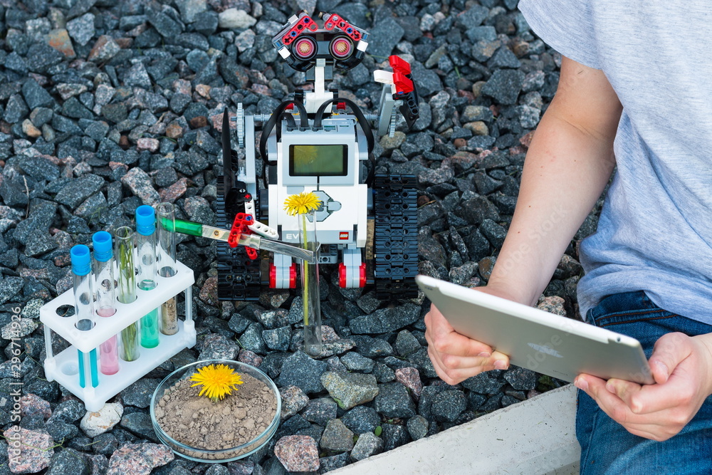 Minsk, Belarus. February, 2017: Teenager schoolboy constructs and ...