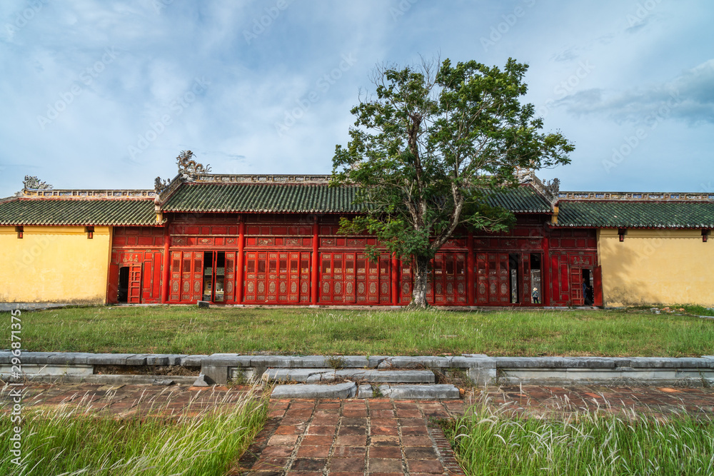 Oriental red monument in Imperial City, Hue. Famous gallery behind tall ...
