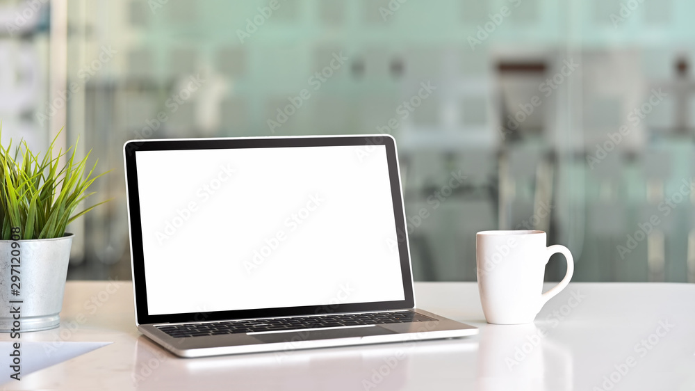 Workspace with laptop computer, coffee mug and plant pot. Stock Photo ...