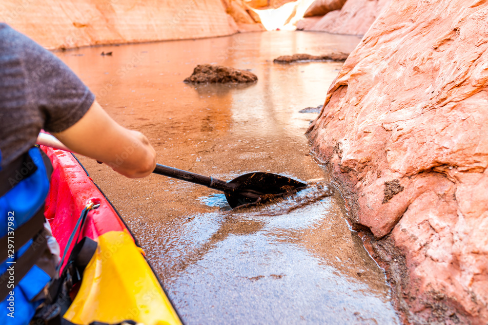 Kayaking in Lake Powell narrow and shallow antelope canyon with man ...