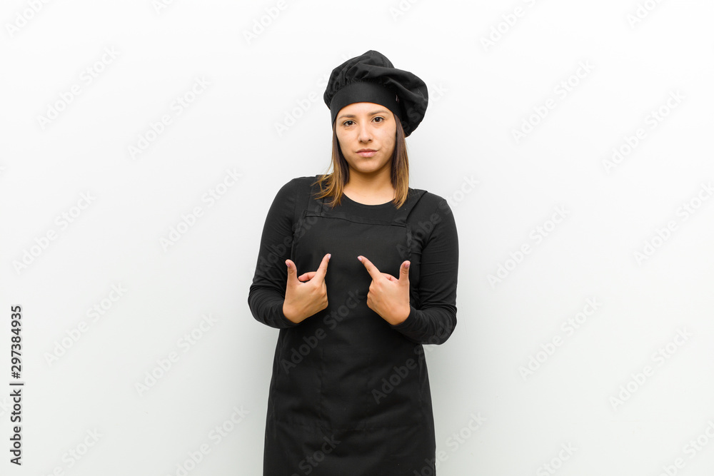 cook woman pointing to self with a confused and quizzical look, shocked ...