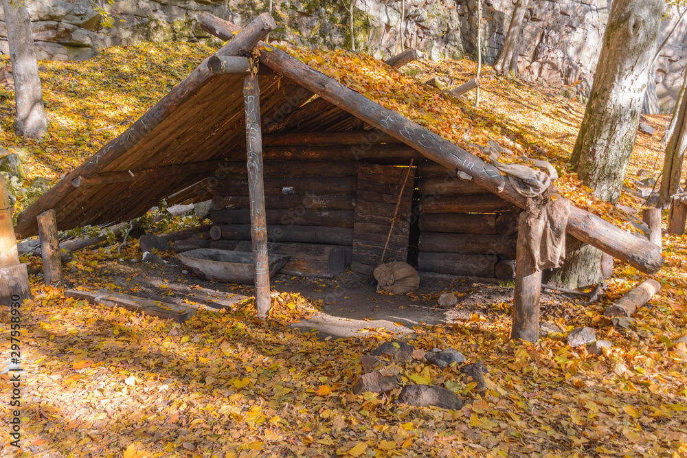 Dugout (or dug-out, pit-house, earth lodge, cellar dug) from logs in ...