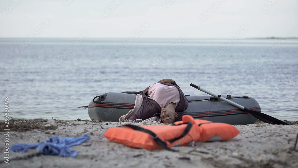 Foto de Stock Unconscious girl lying on boat near beach, drowned ...