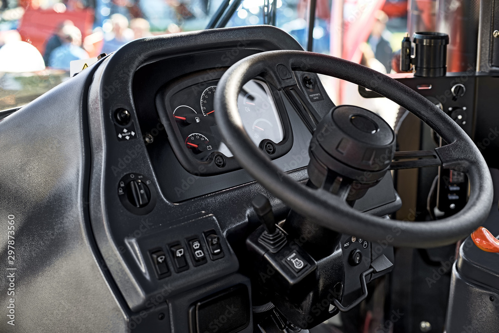 Steering wheel and the controls in the cabin of the new tractor Stock ...