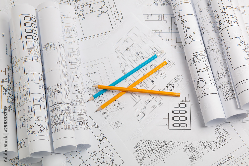 Electronics and Engineering. Pencil on printed drawings of electrical ...
