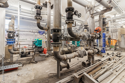 pumping station under construction. pipes of central heating system and ...