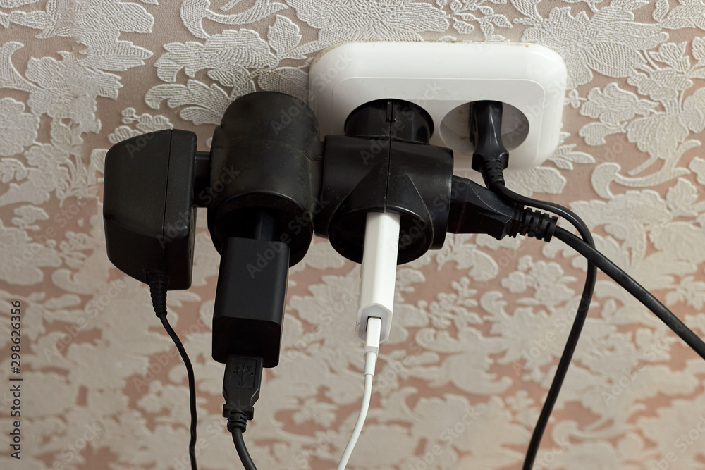 Improper use power supply. Overloaded socket, spark. Danger of electric ...
