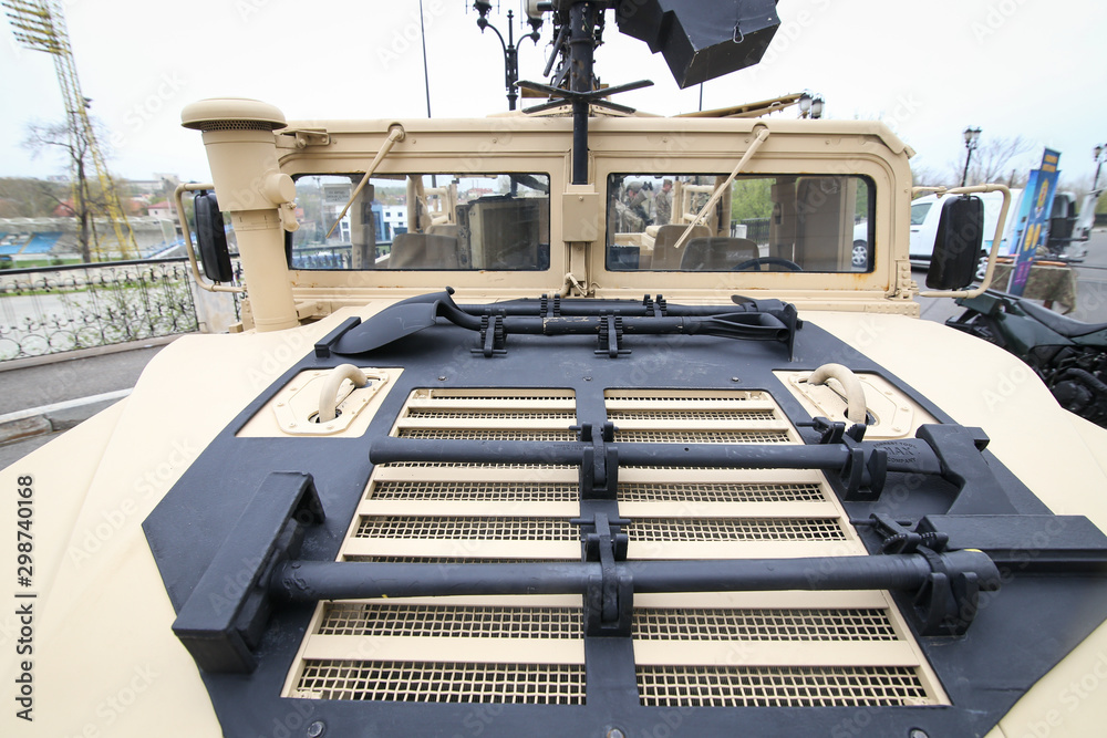 Tools mounted on the hood of a Humvee military vehicle - hammer, axe ...