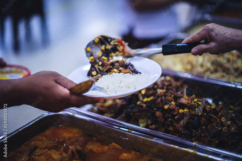 Refugee's Hands Receive Food with Starvation from a Donor's Food of ...
