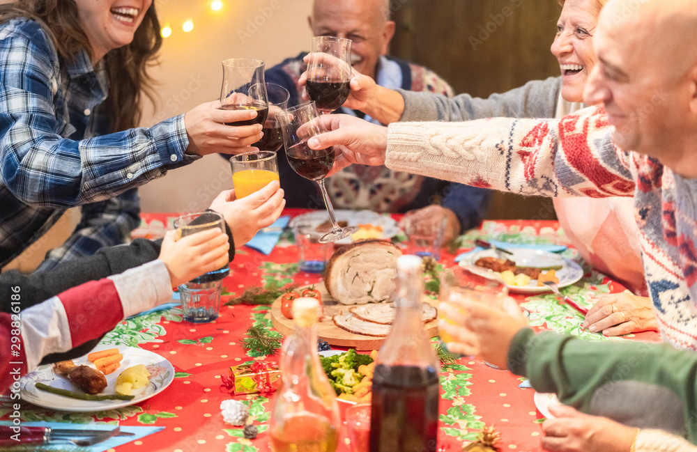 Happy family cheering at holiday dinner - Group of people celebrating ...