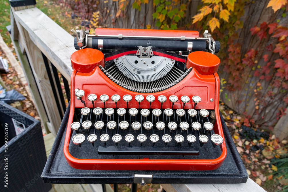 Vintage red orange portable typewriter from the 20s. Stock Photo ...