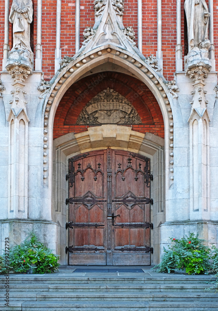 Gothic cathedral entrance. Church spire of Saint Joseph Church (Parish ...