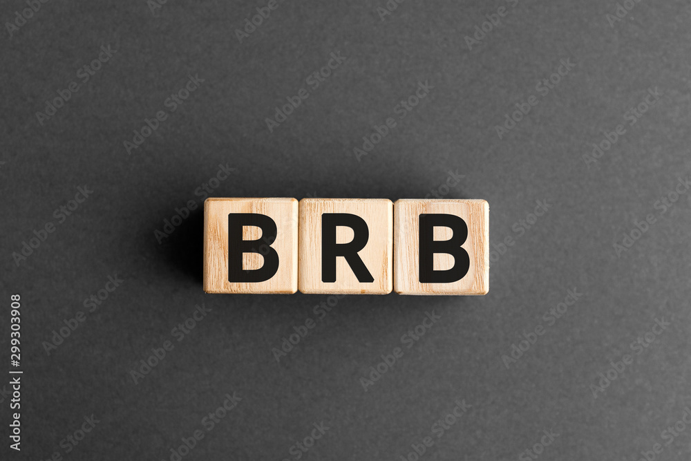 BRB - acronym from wooden blocks with letters, abbreviation Be Right ...