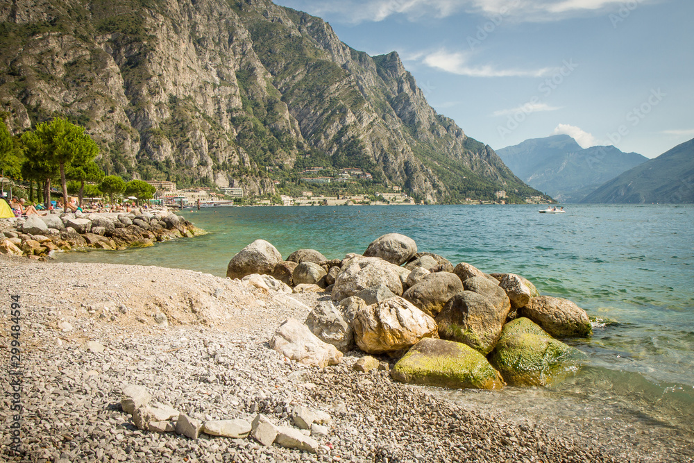 A pile of large stones on beach of lake Lago Di Garda - Limone sul ...