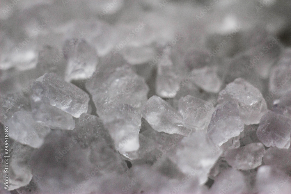 Translucent pieces of salt, transparent sand. Blocks of ice, macro ...