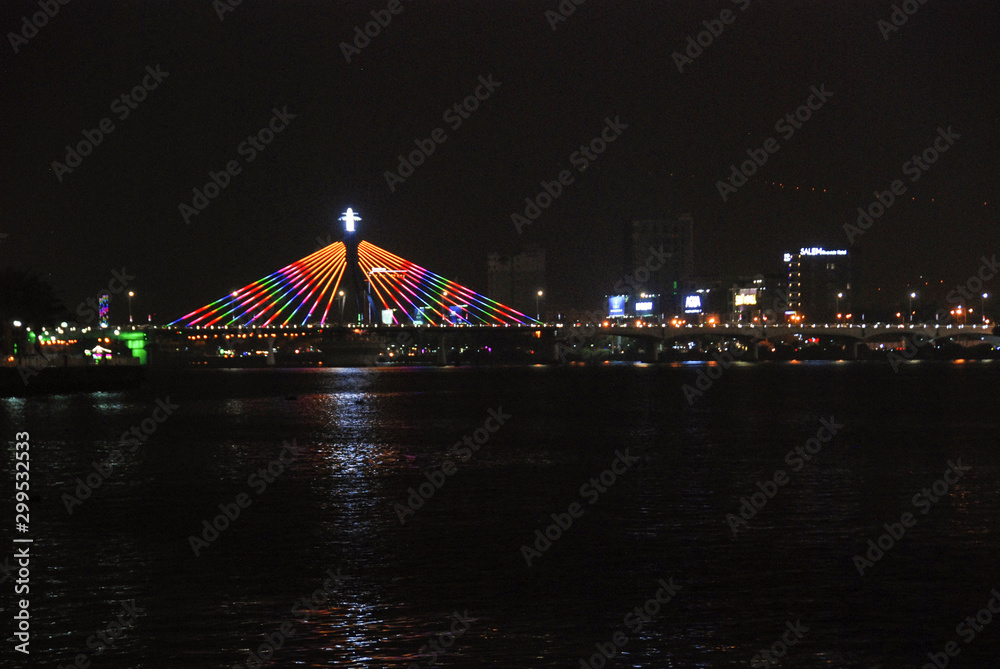 Han River Bridge colorfully illuminated at night and reflected in a ...