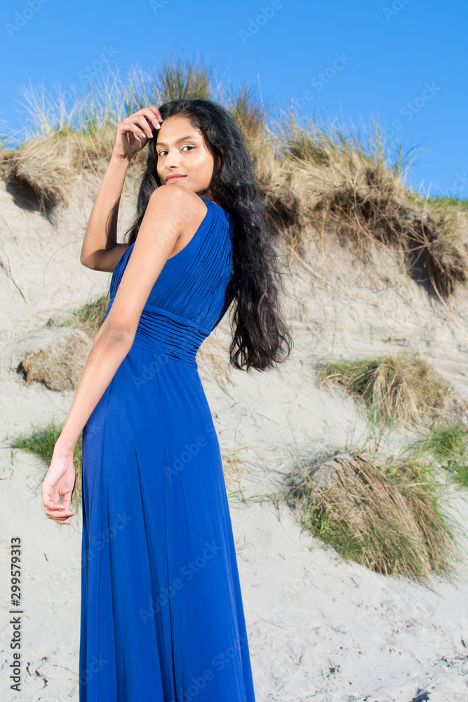 Beautiful model looking back at camera at the beach in Sligo in Ireland ...