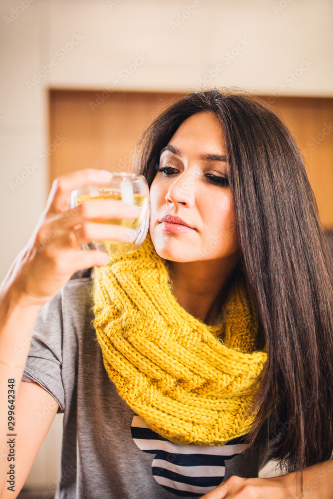 A cold sad oriental brunette with an attractive appearance in a knitted ...
