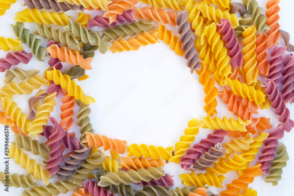 Colored pasta in the shape of a spiral. Pasta of different colors top ...