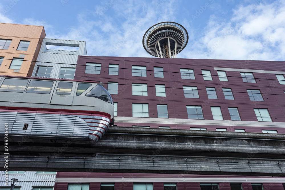 Top of Space Needle looking down at colorful modern buildings behind ...