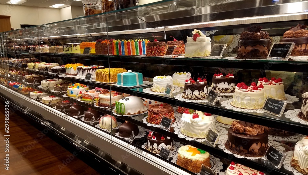 We Have Cake! Sweet Tooth Shopping in Store For Baked Goods; Rows of ...