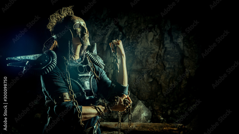 Post-apocalyptic woman in the rusty skull mask on the dungeon ...