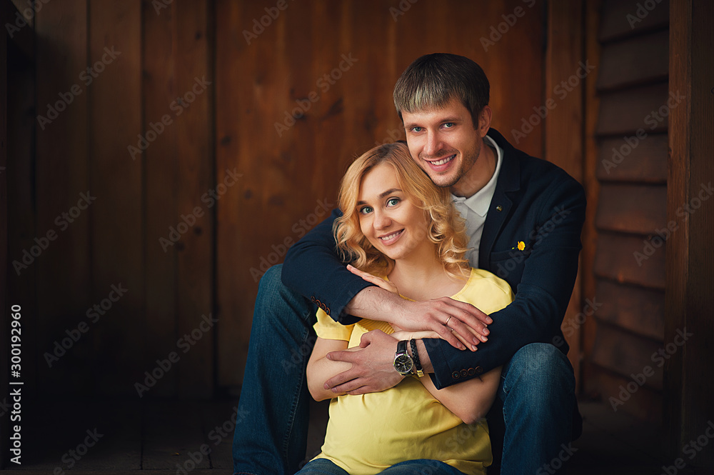 image of beautiful pregnant woman and her handsome husband hugging the ...
