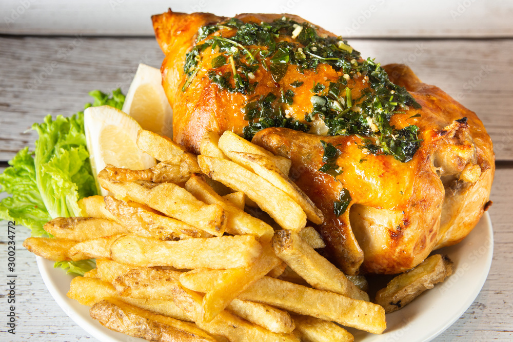 pollo al spiedo con frtias Stock Photo | Adobe Stock