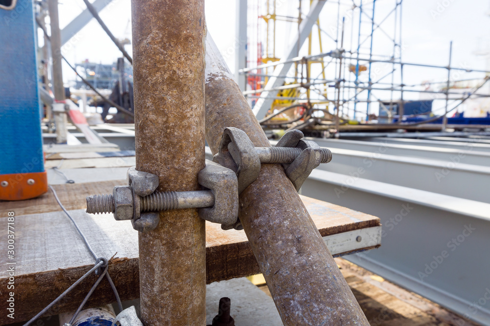 Scaffolding tube with clamp erected for structure installation on board ...