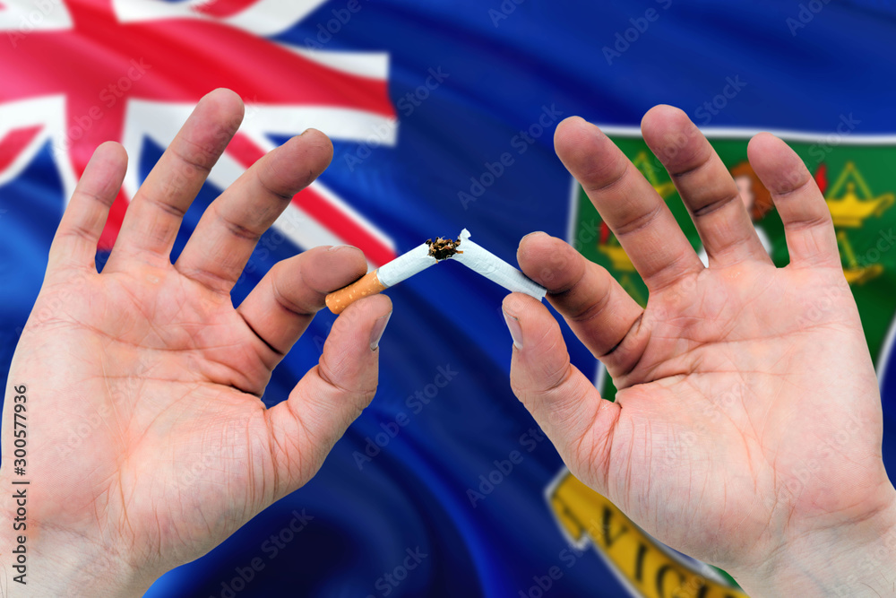 British Virgin Islands quit smoking cigarettes concept. Adult man hands ...