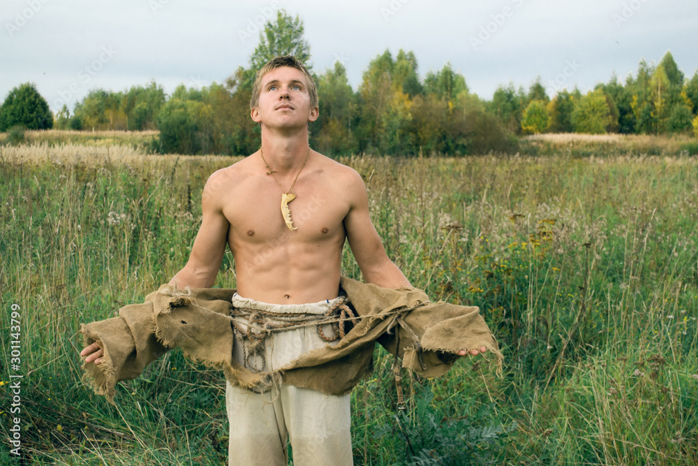 Downshifting concept - medieval peasant in a ragged clothes ...