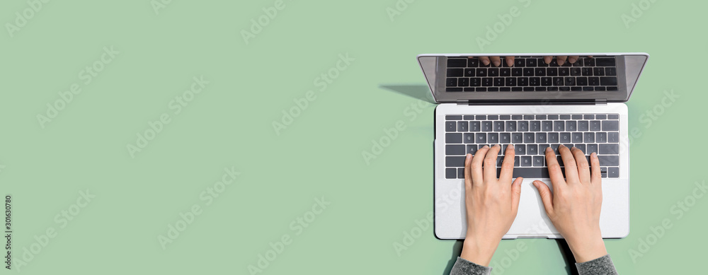 Person using a laptop computer from above Stock Photo | Adobe Stock