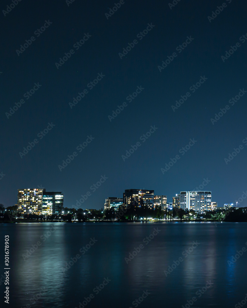 View of Canberra city at night showing the Ovolo Nishi Hotel, NewActon ...