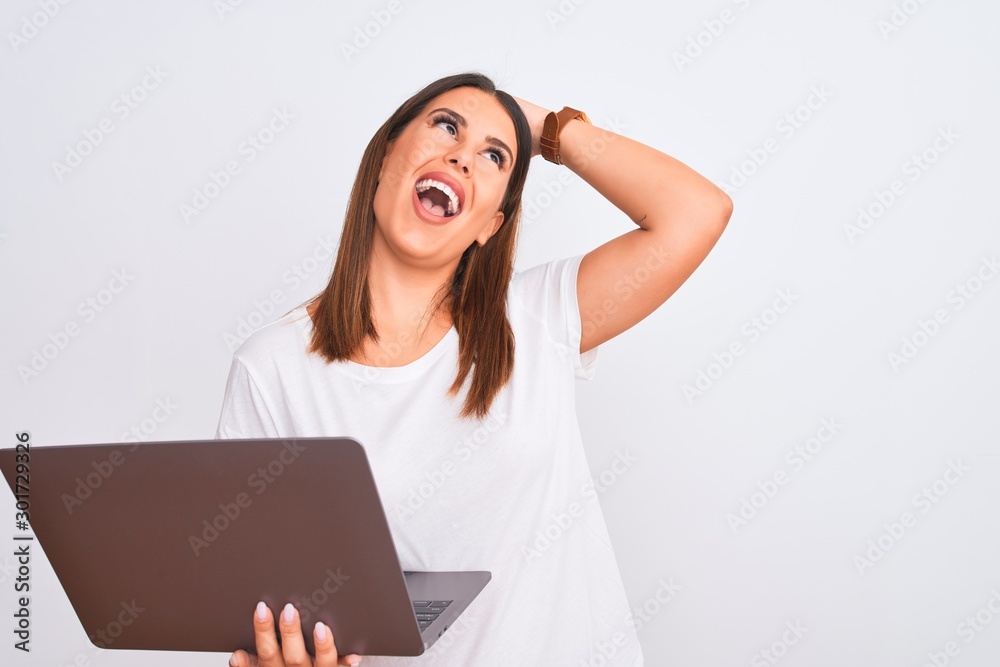 Beautiful young woman working using computer laptop over white ...