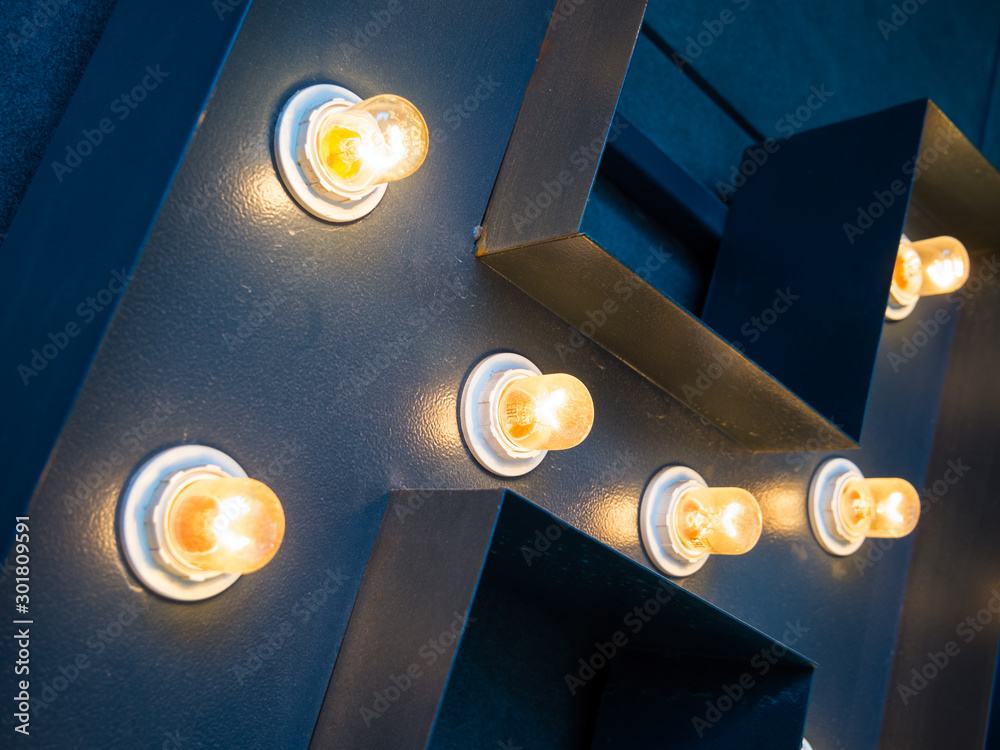 Highlighting outdoor advertising letters with yellow lights Stock Photo ...