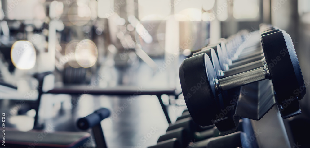gym interior background of dumbbells on rack in fitness and workout ...