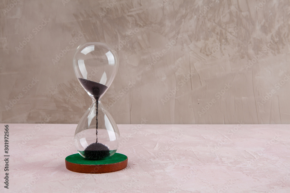 Time is running out concept depicted with hourglass on beautiful ...