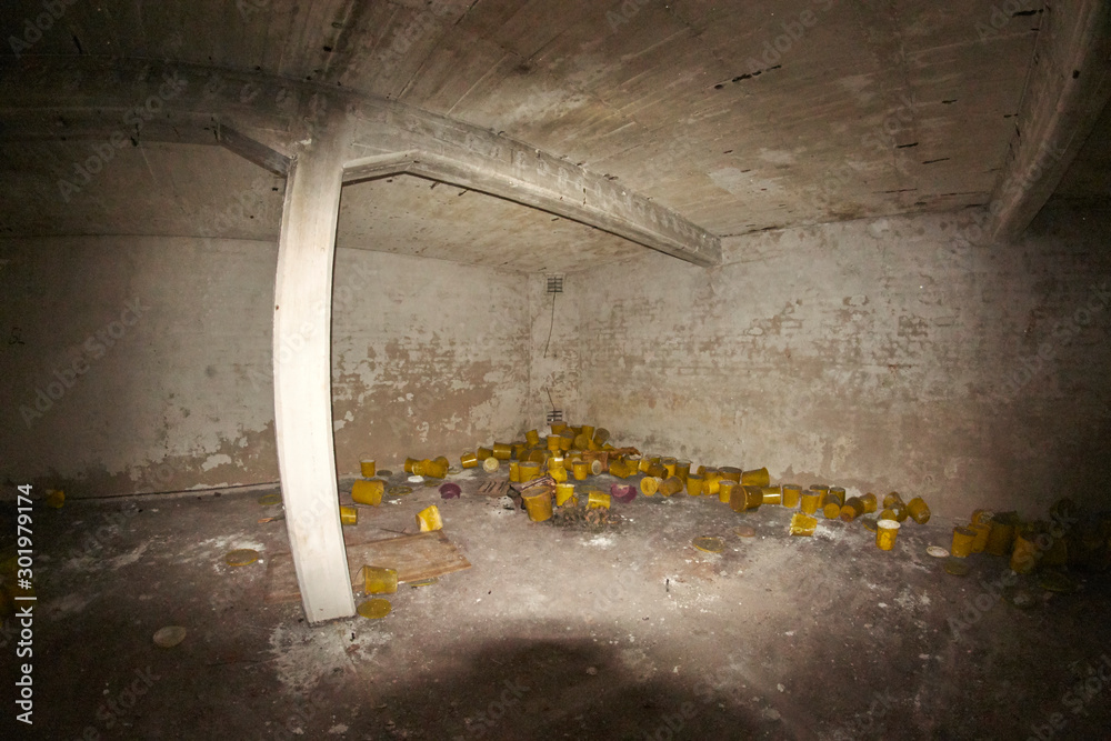 Yellow buckets inside of abandoned WWII bunker Stock Photo | Adobe Stock