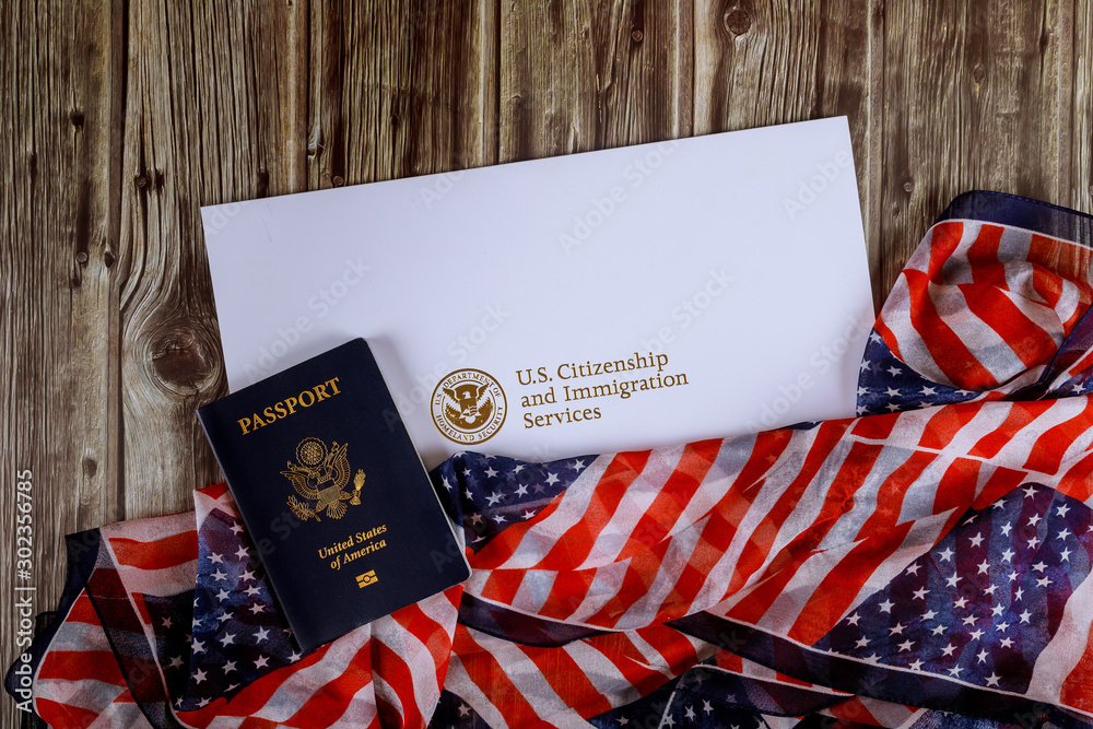 USA passport and naturalization certificate of citizenship US flag over ...